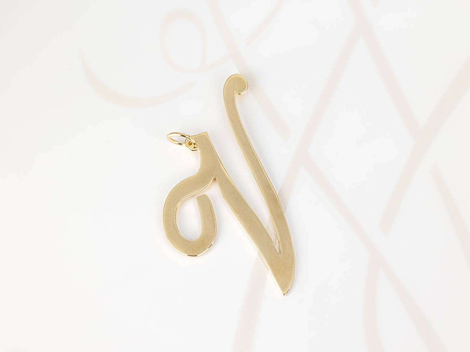 DIJE ORO LAMINADO CURSIVA V LISO